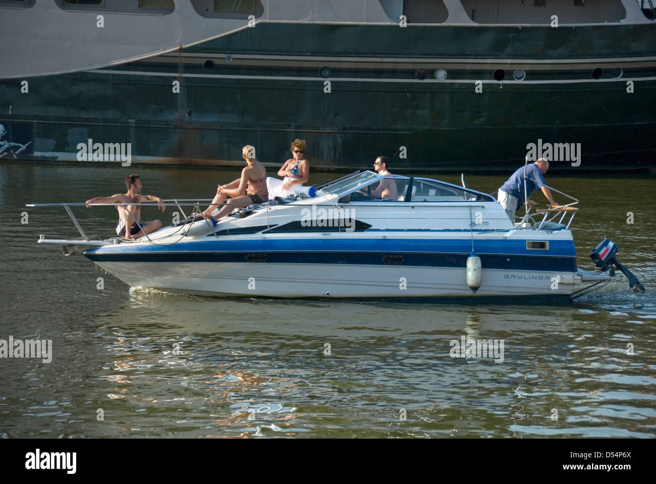 People on a motorboat, Bristol harbour, England, UK Stock Photo - Alamy