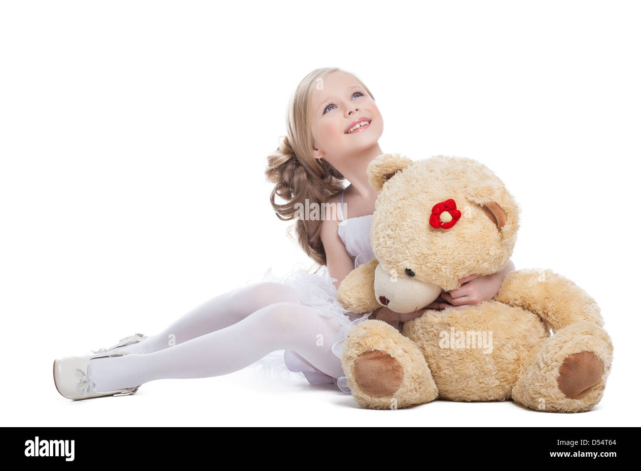 Beautiful little girl hugging big teddy bear Stock Photo - Alamy