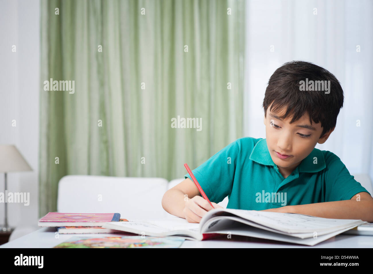 Boy doing his homework Stock Photo - Alamy
