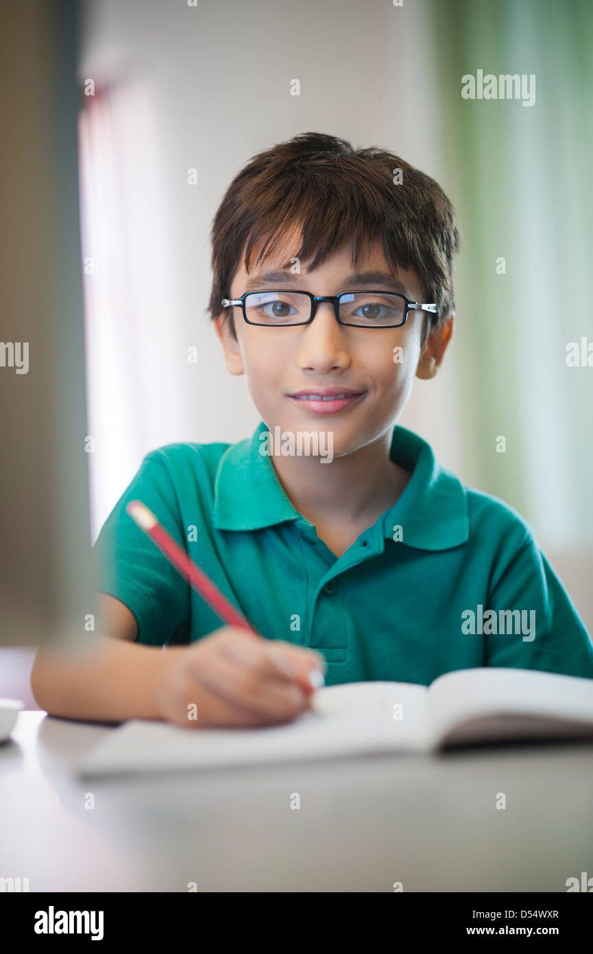 Boy doing his homework Stock Photo - Alamy