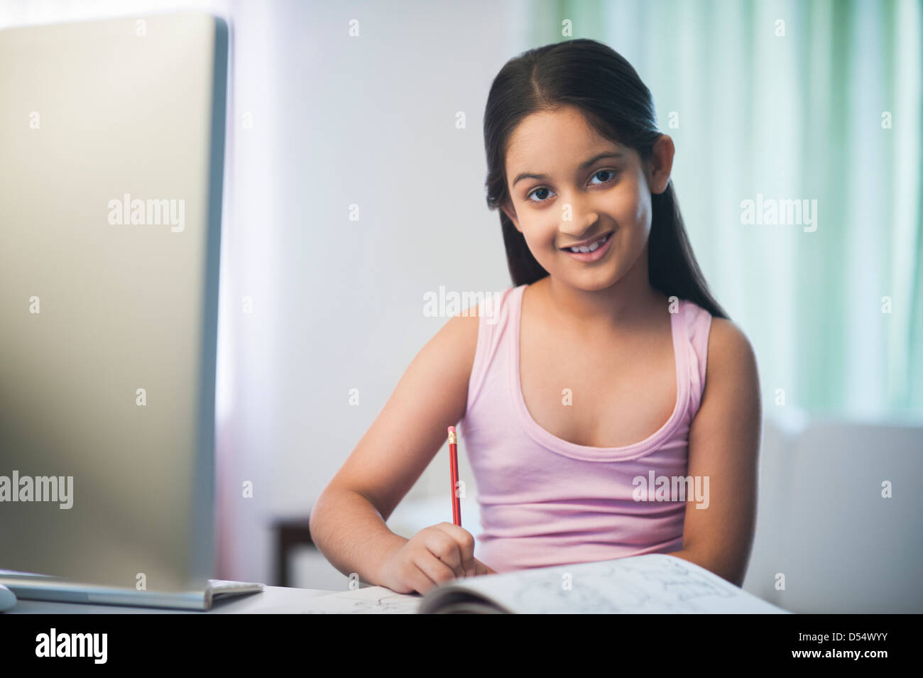 Girl studying in front of a desktop pc Stock Photo - Alamy
