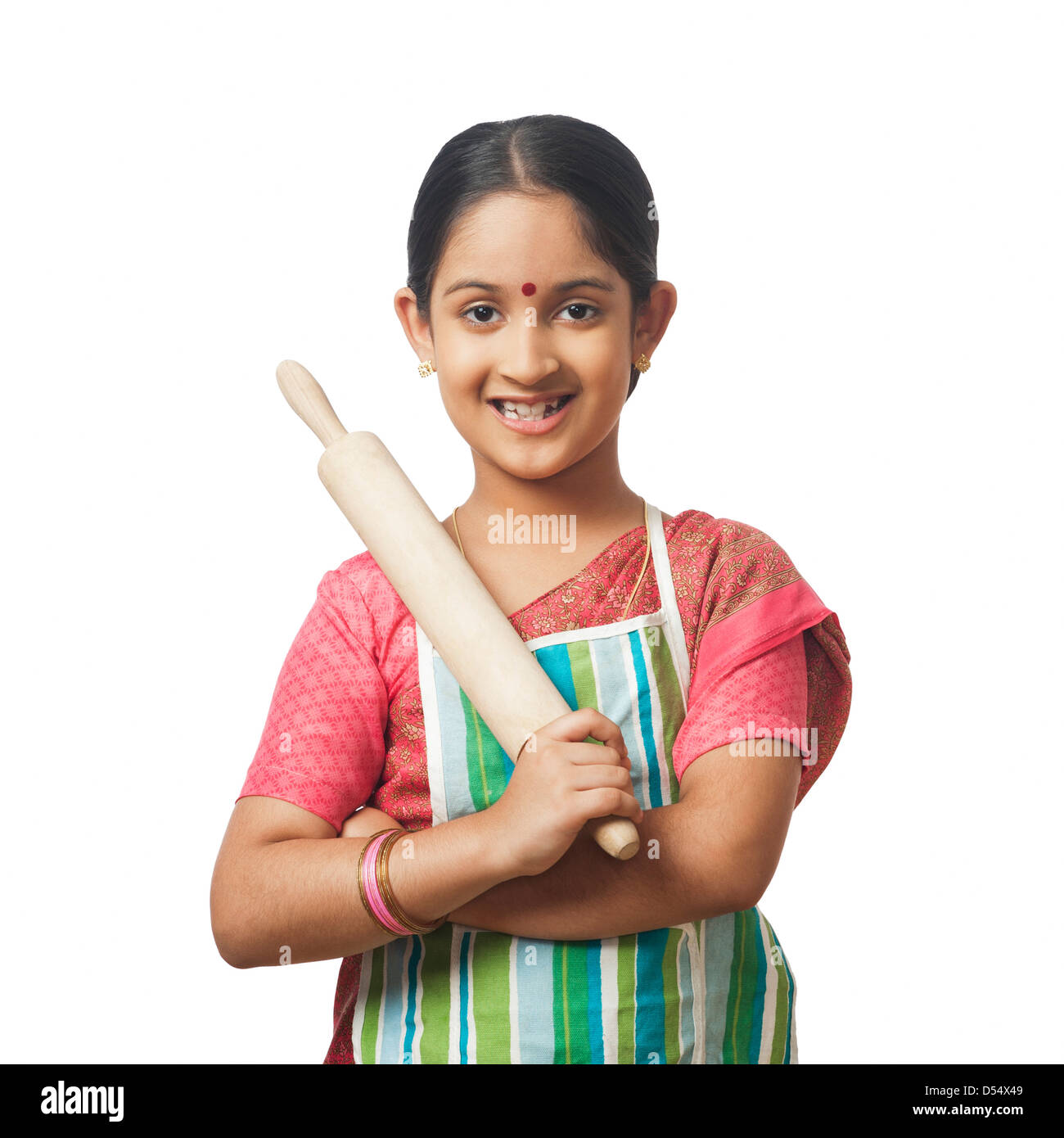 Portrait of a girl imitating like woman holding a rolling pin on her ...