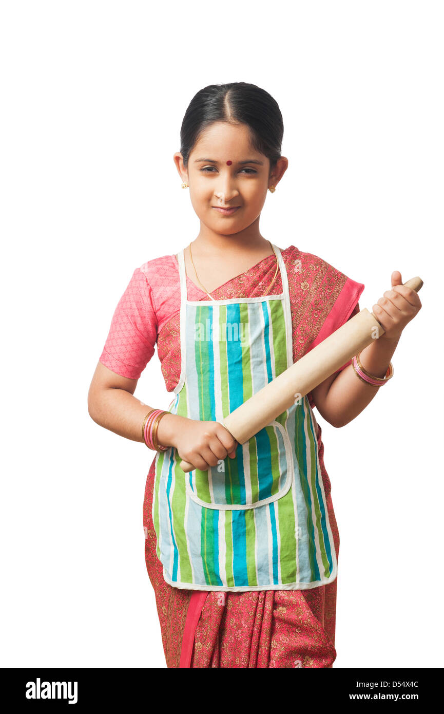 Portrait of a girl imitating like woman holding a rolling pin Stock ...