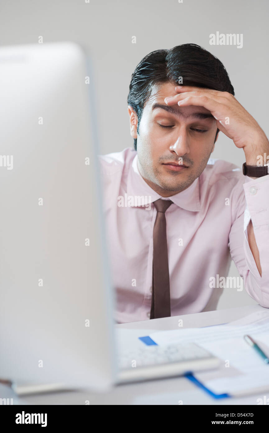 Man at office with tired eyes vertical hi-res stock photography and ...