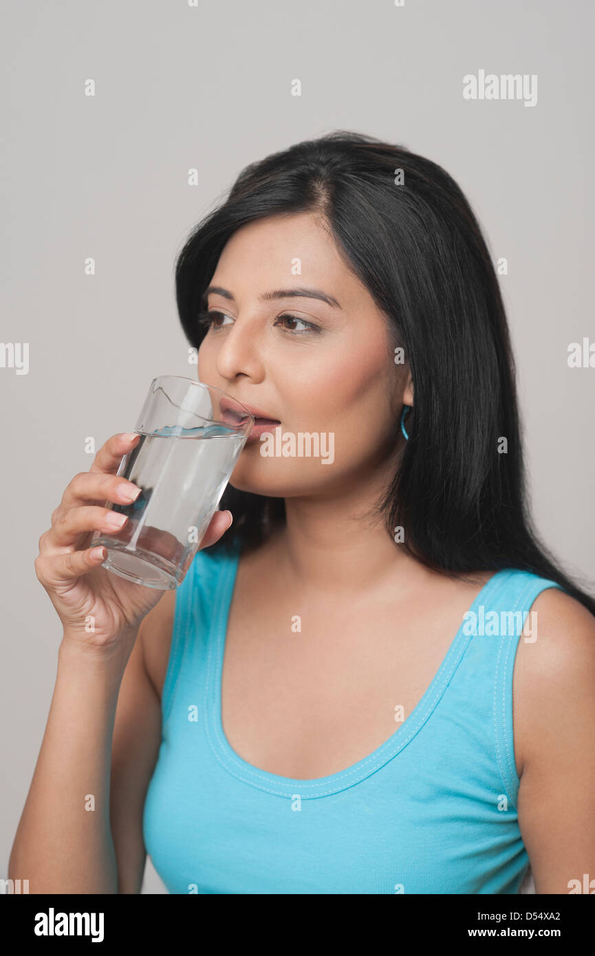 Woman drinking water Stock Photo - Alamy