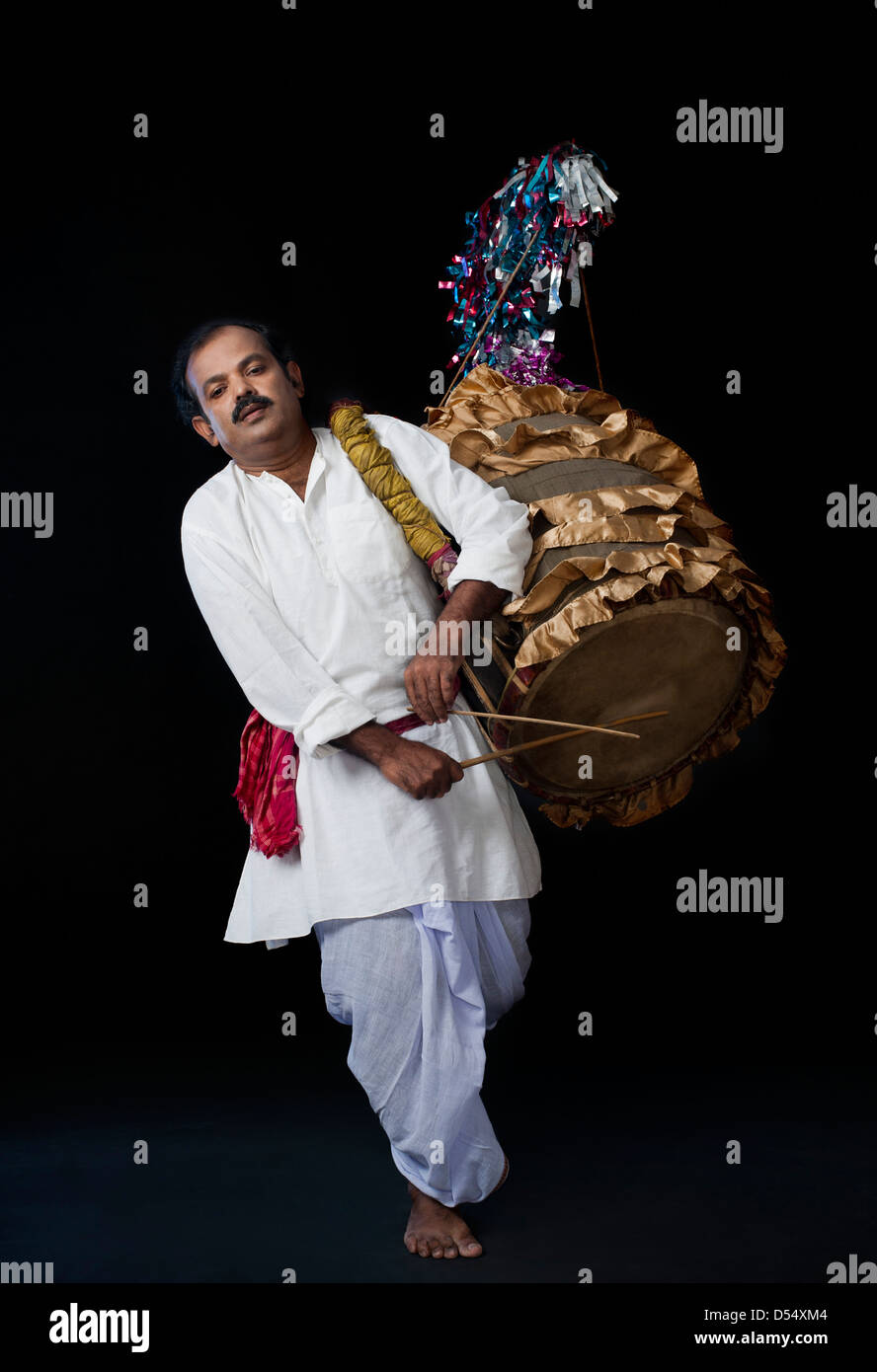 Man playing musical instrument dhol hi-res stock photography and images ...