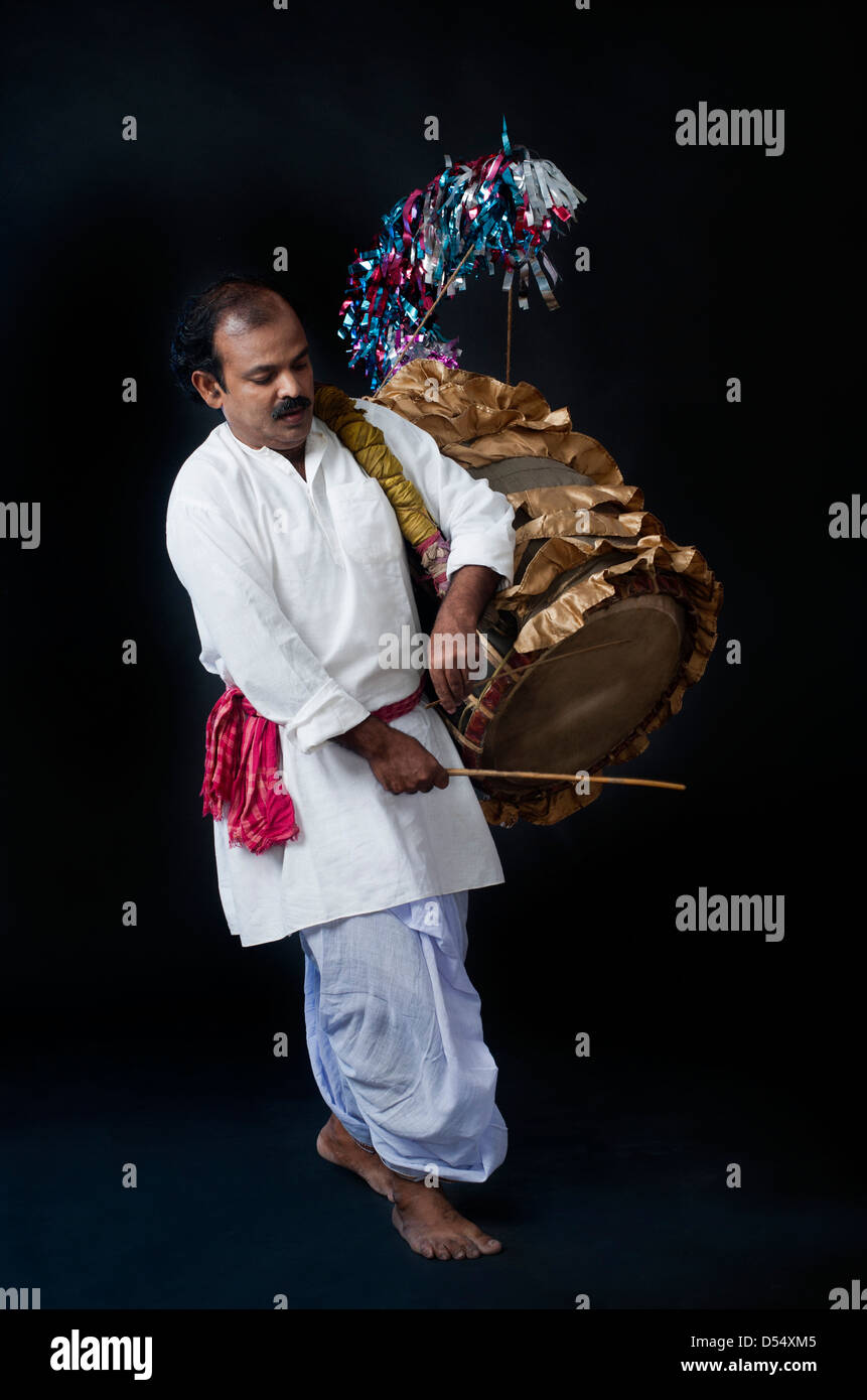 Man playing musical instrument dhol hi-res stock photography and images ...