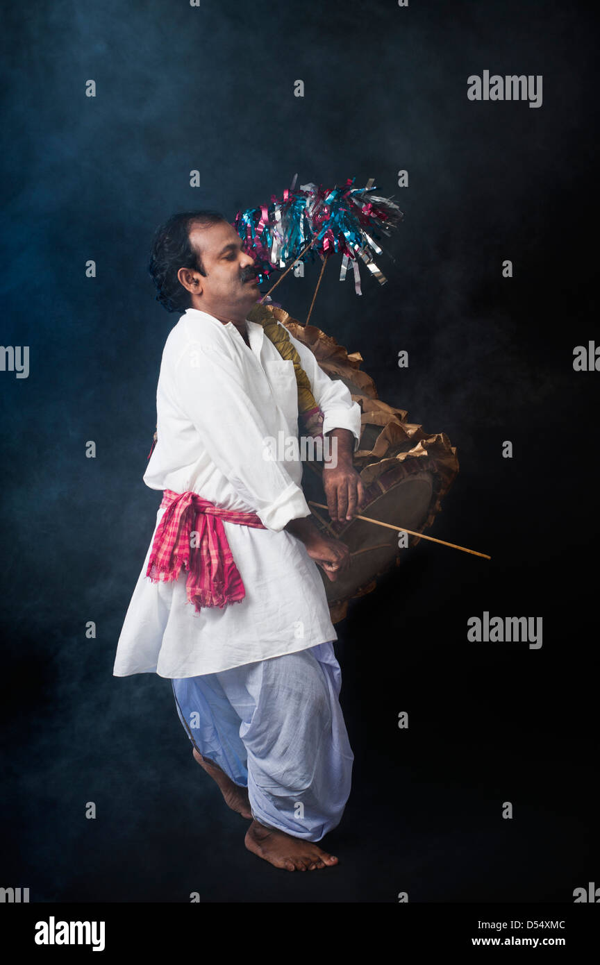 Man playing musical instrument dhol hi-res stock photography and images ...