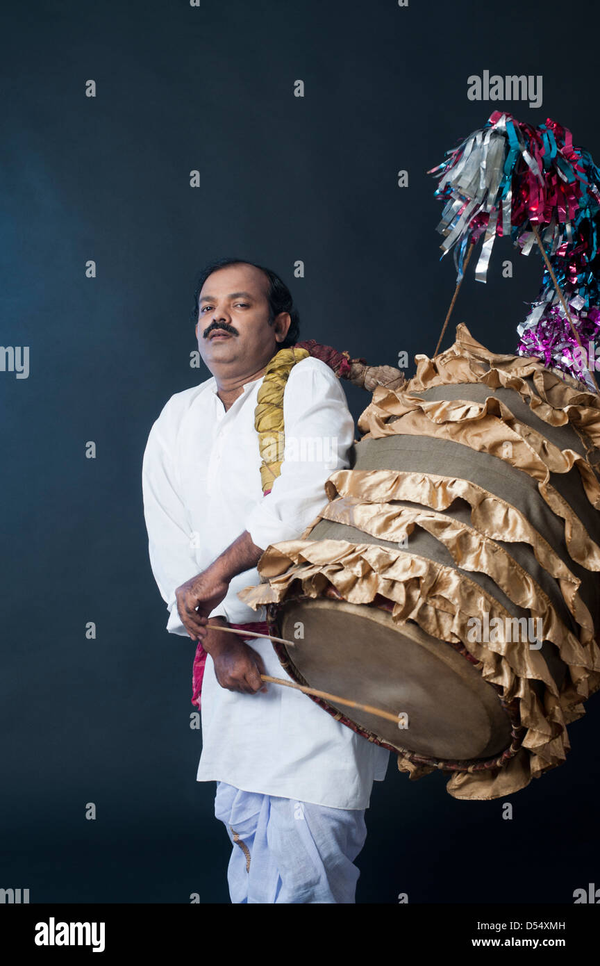 Man playing musical instrument dhol hi-res stock photography and images ...