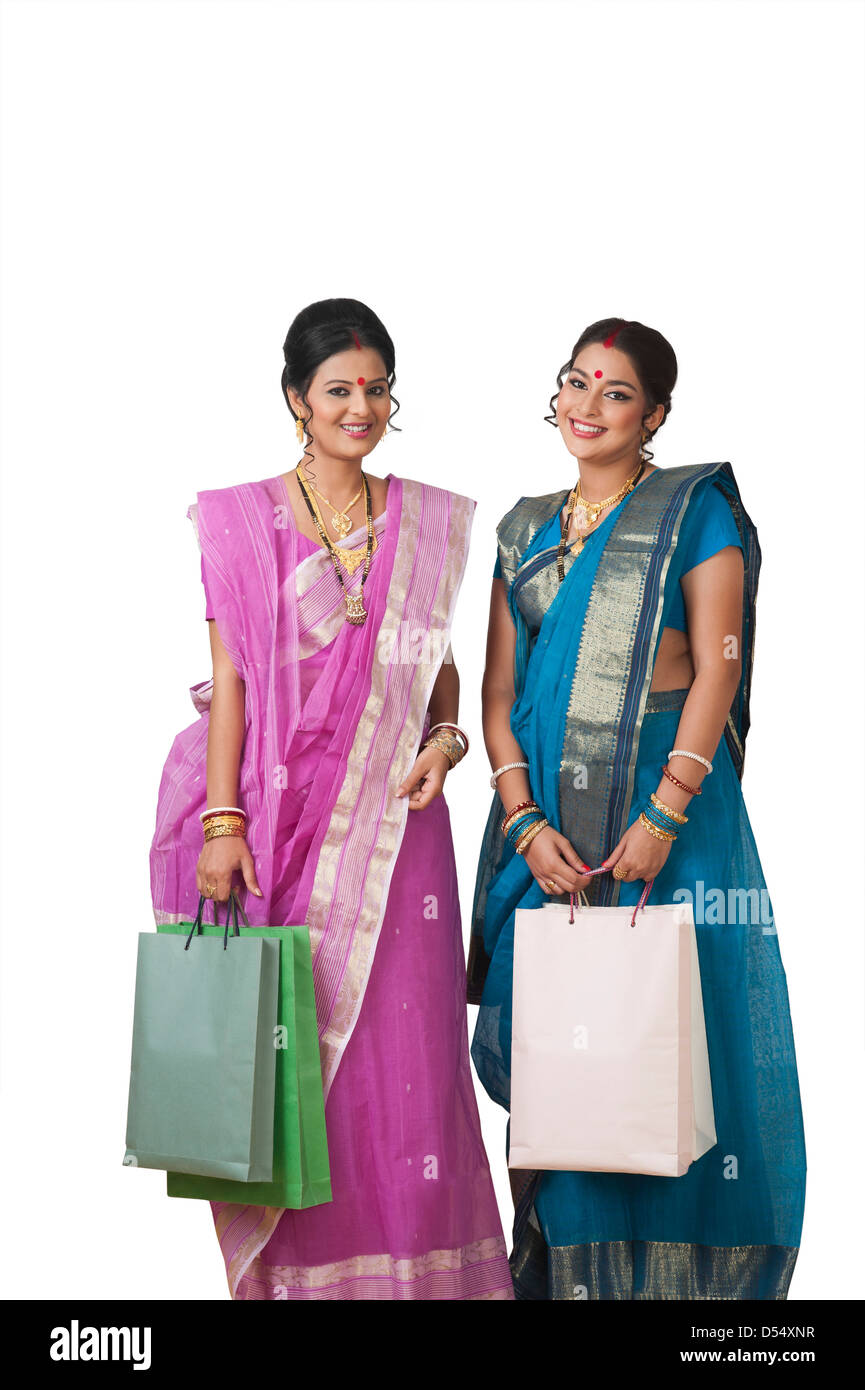 Portrait of two Bengali women carrying shopping bags and smiling Stock ...
