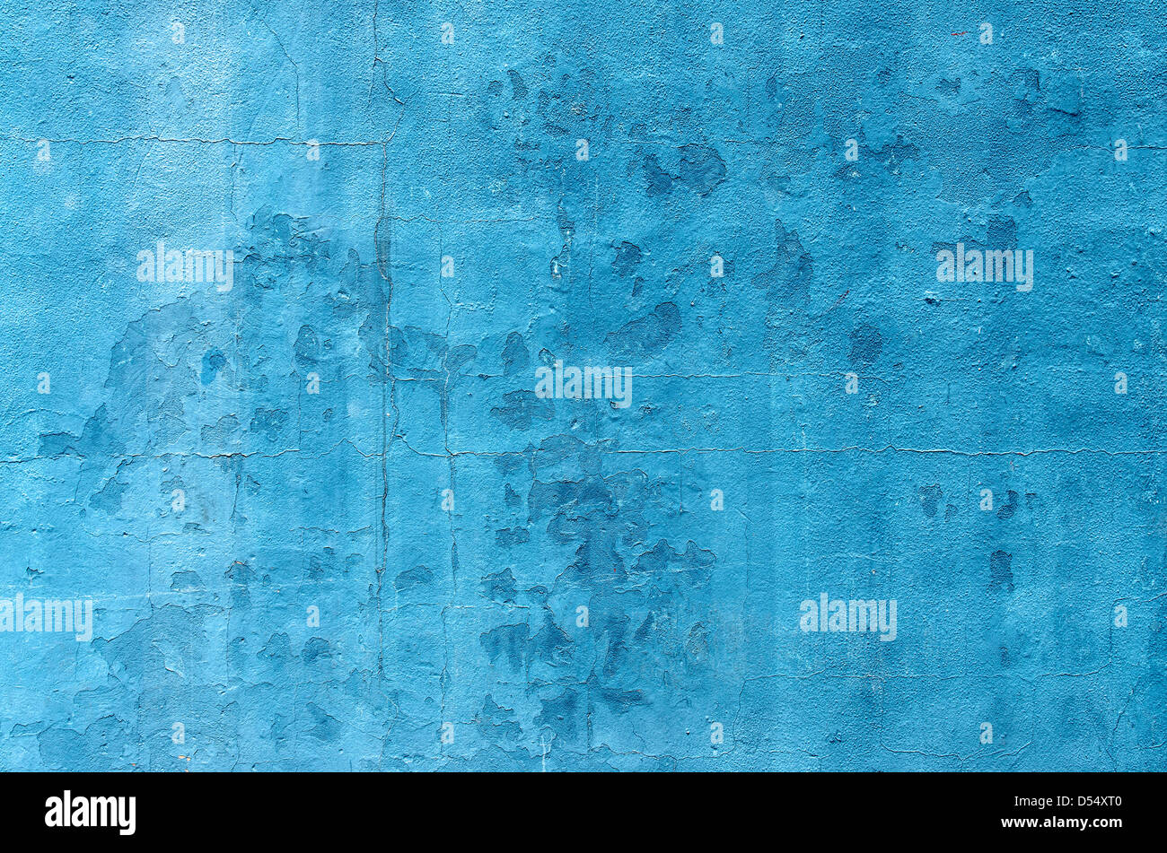 Blue paint on an exterior wall cracked and flaking to reveal old ...