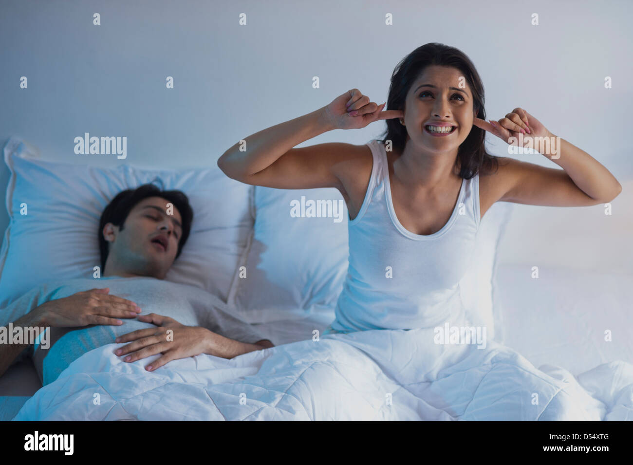 Indian couple sleeping in bed hi-res stock photography and images - Alamy