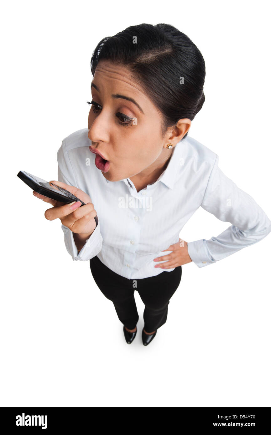 Businesswoman shouting at a mobile phone Stock Photo - Alamy