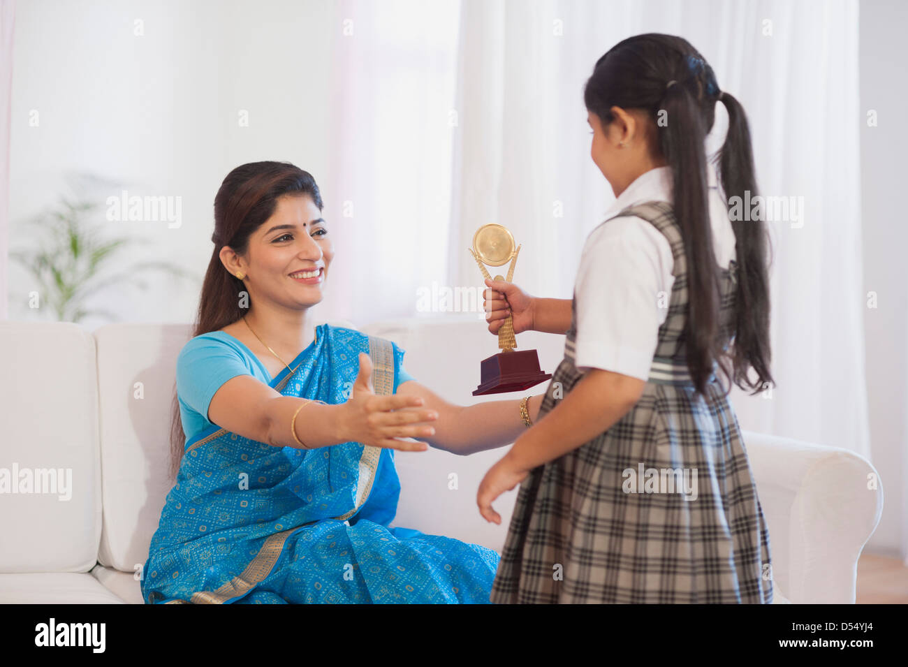 Girl showing winning trophy hi-res stock photography and images - Alamy