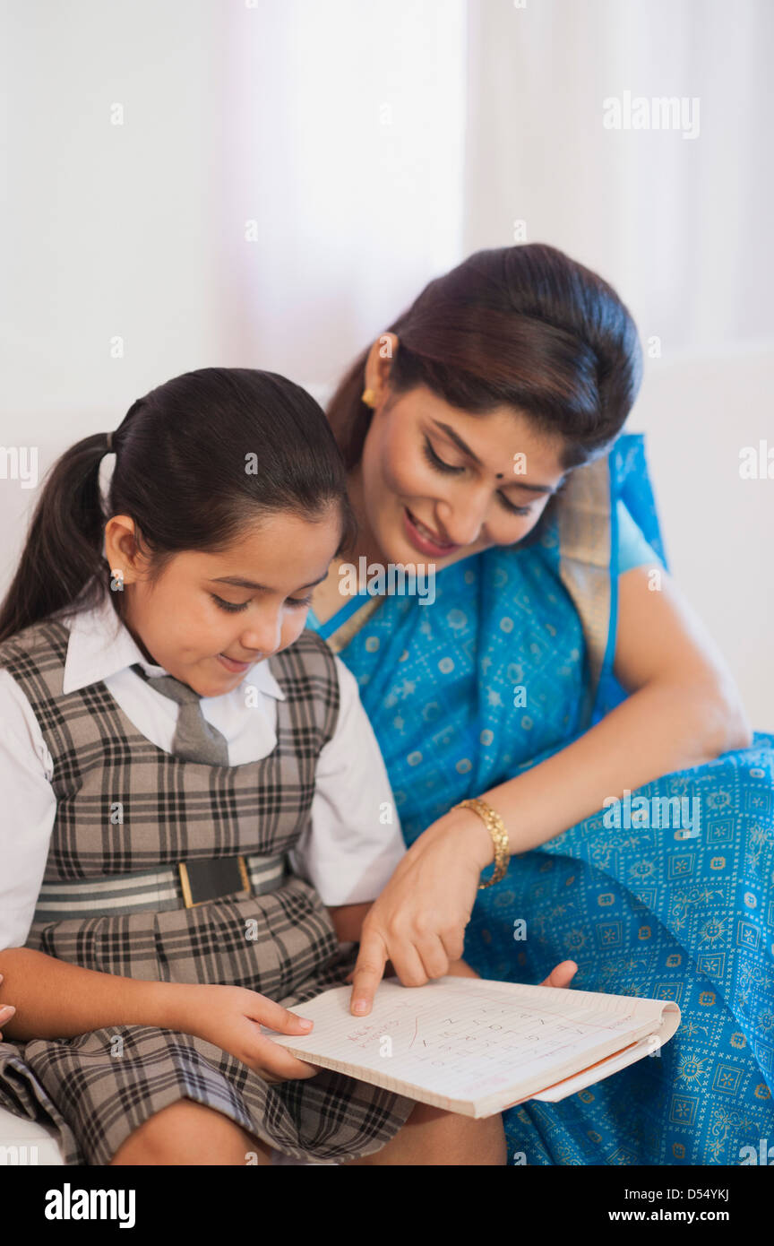 Woman teaching her daughter Stock Photo - Alamy