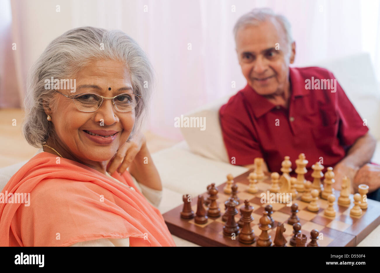 Senior couple playing chess Stock Photo - Alamy