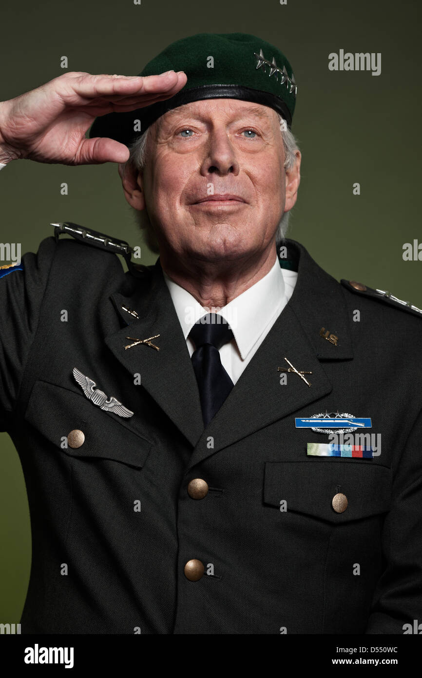 US military general wearing beret. Salutation. Studio portrait Stock ...