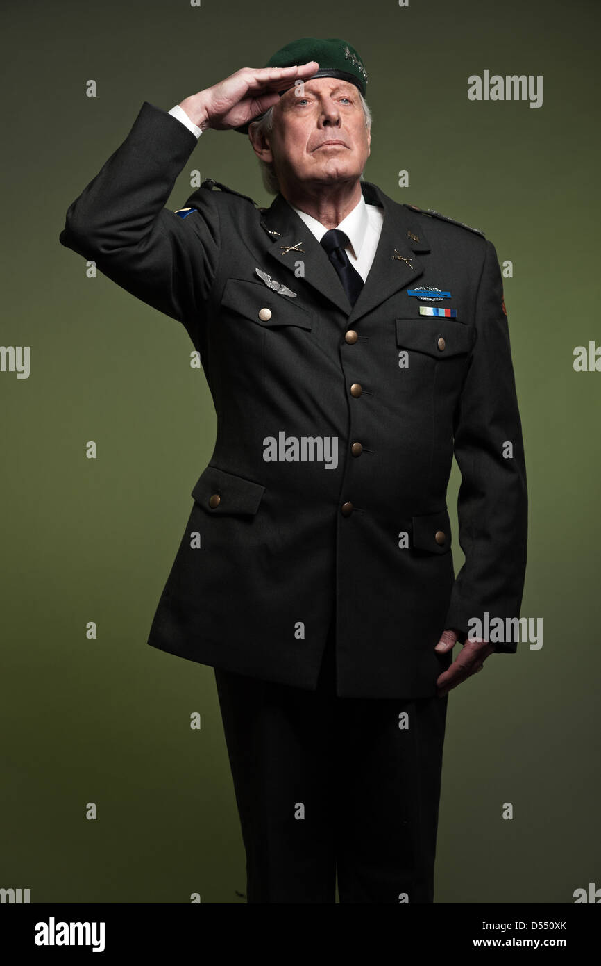 US military general wearing beret. Salutation. Studio portrait Stock ...