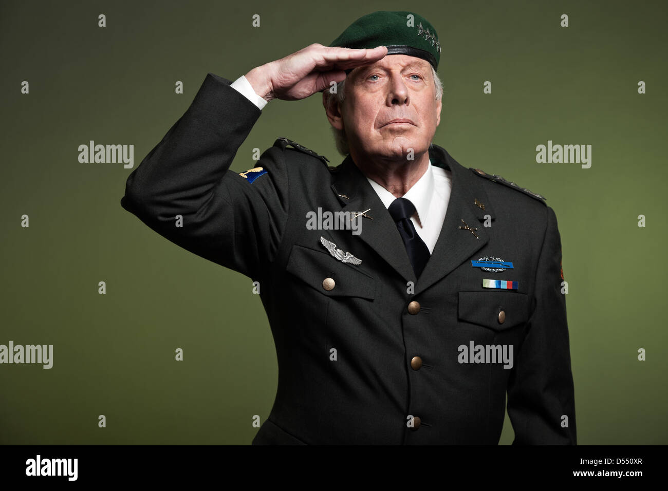 US military general wearing beret. Salutation. Studio portrait Stock ...