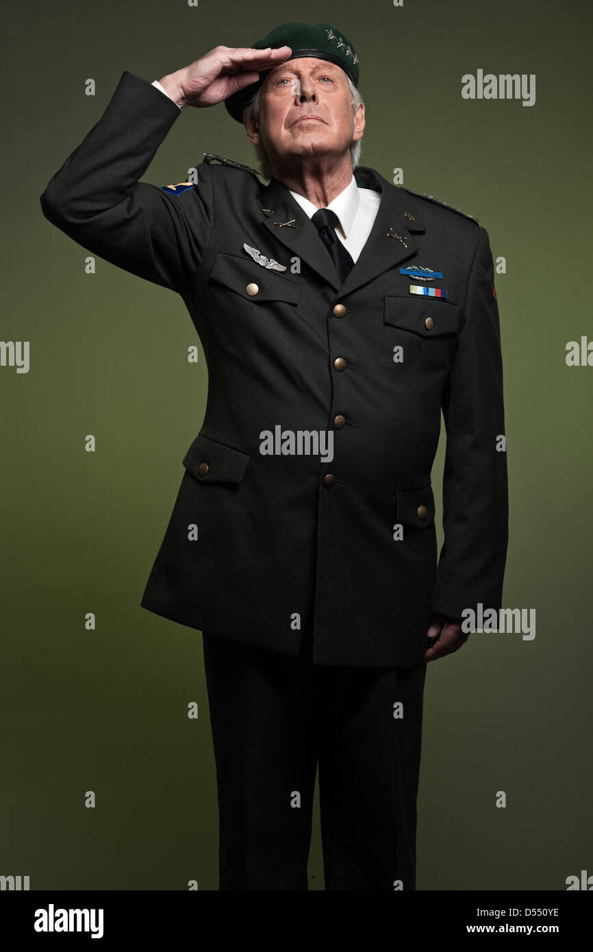 US military general wearing beret. Salutation. Studio portrait Stock ...