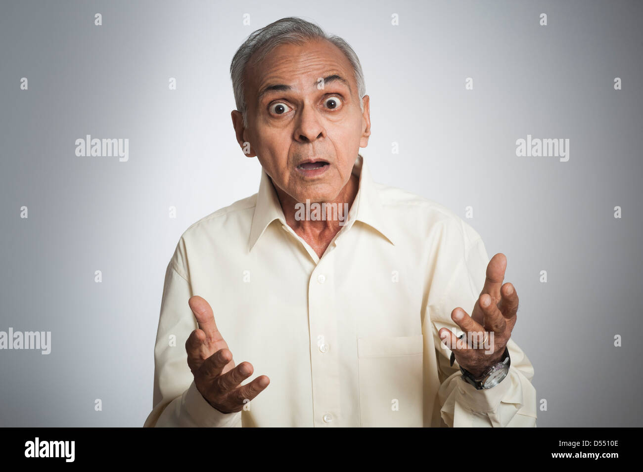 Portrait of a man looking surprised Stock Photo - Alamy