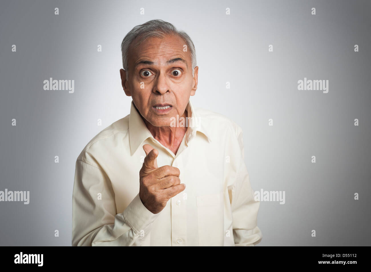 Portrait of a man pointing and arguing Stock Photo - Alamy