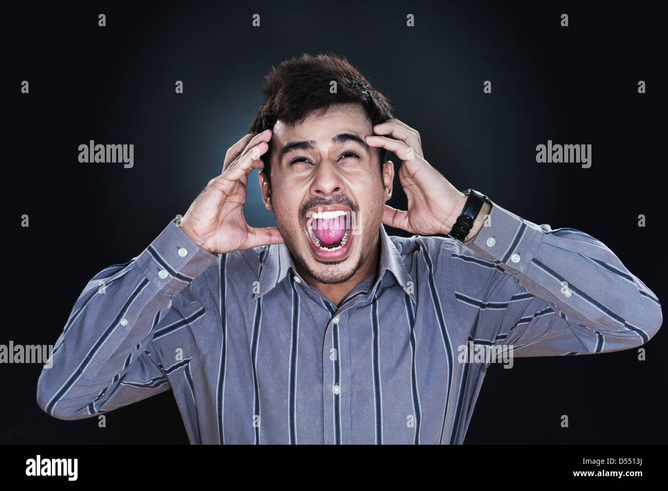 Close-up of a frustrated businessman shouting Stock Photo - Alamy