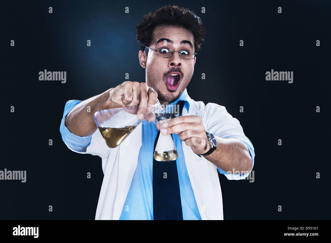 Male scientist experimenting in a laboratory looking surprised Stock ...