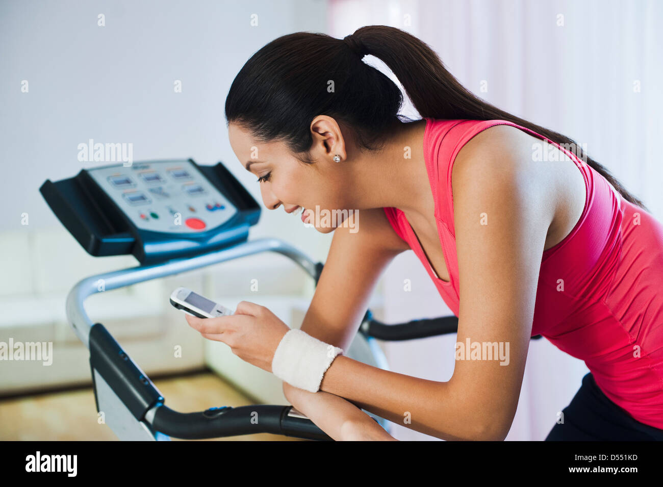 Woman reading exercise machine hi-res stock photography and images - Alamy