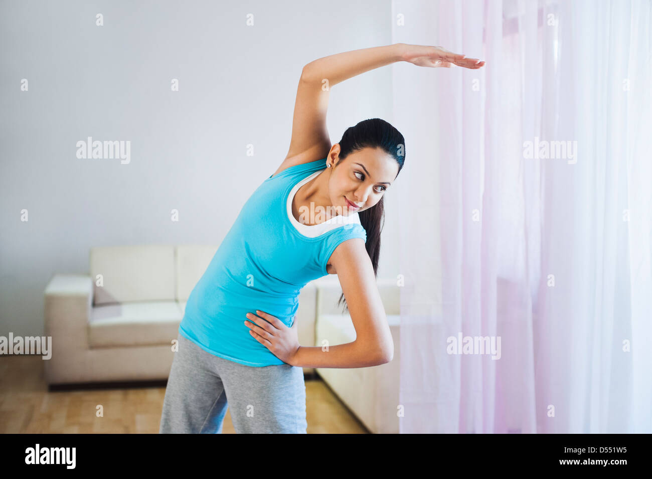 Woman exercising at home Stock Photo - Alamy
