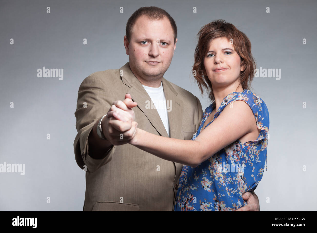 Dancing romantic couple. Man and woman. Studio shot Stock Photo - Alamy