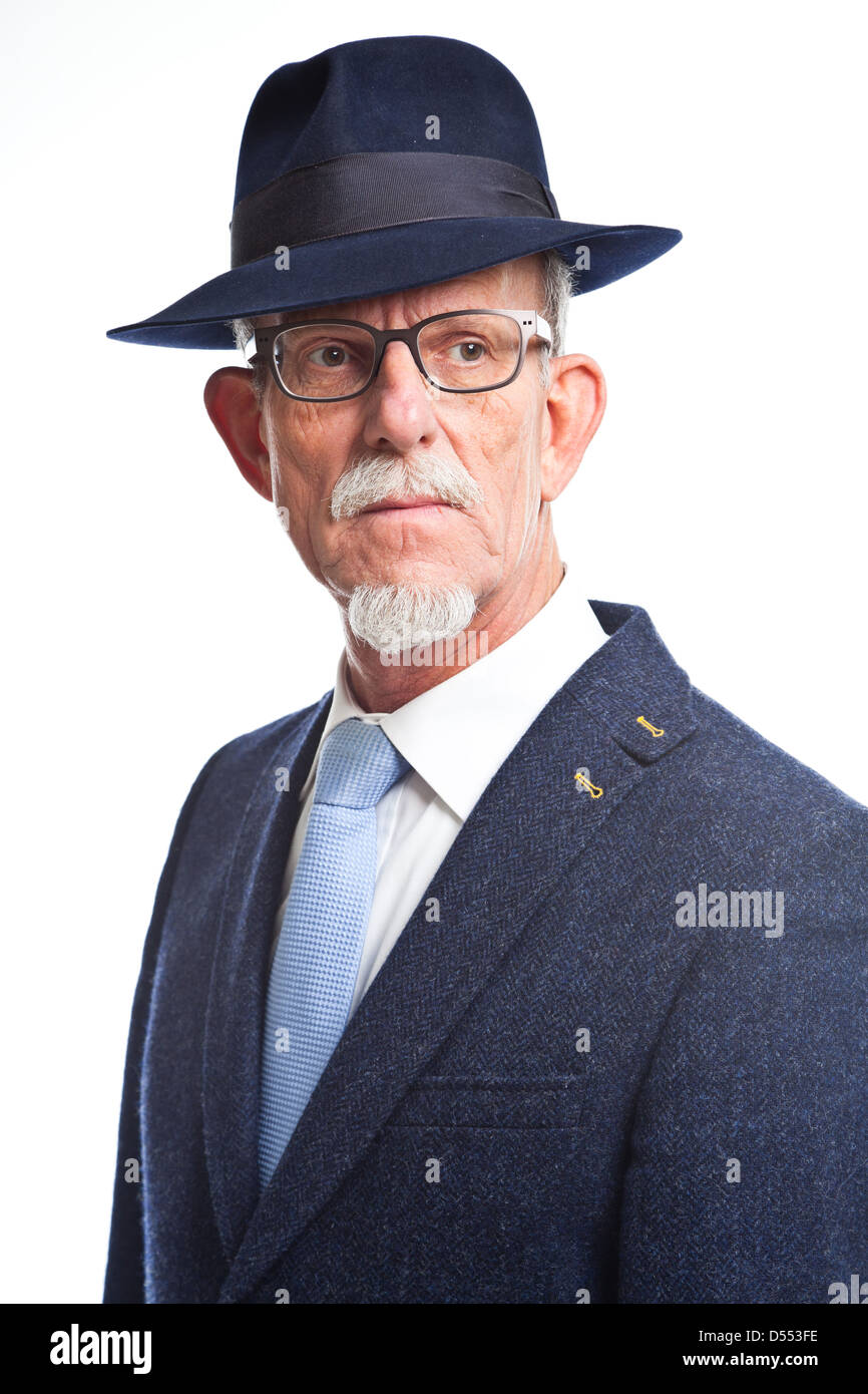 Serious well dressed senior man with hat. Isolated Stock Photo - Alamy
