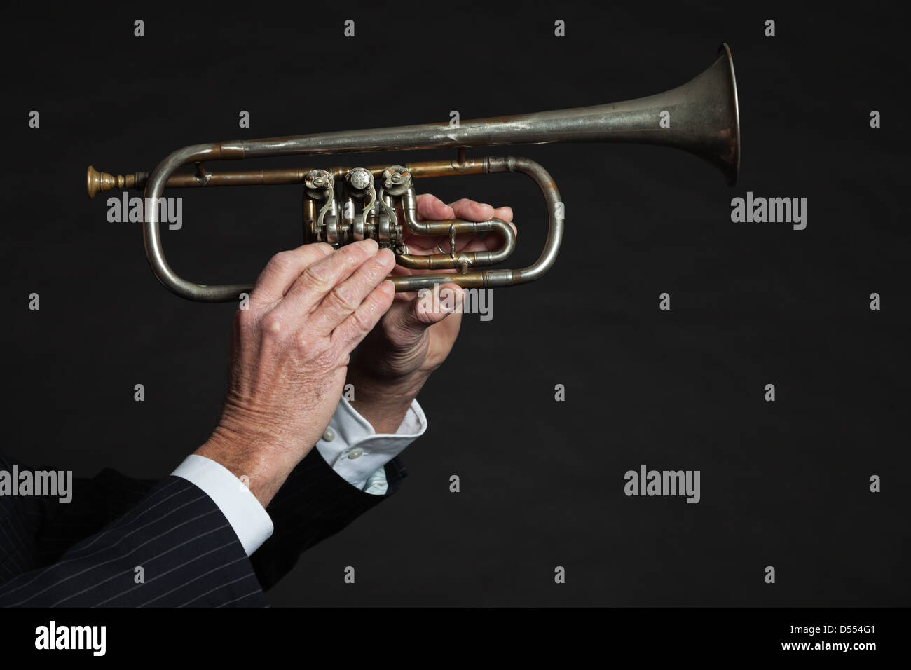 Closeup of senior hands holding trumpet Stock Photo - Alamy