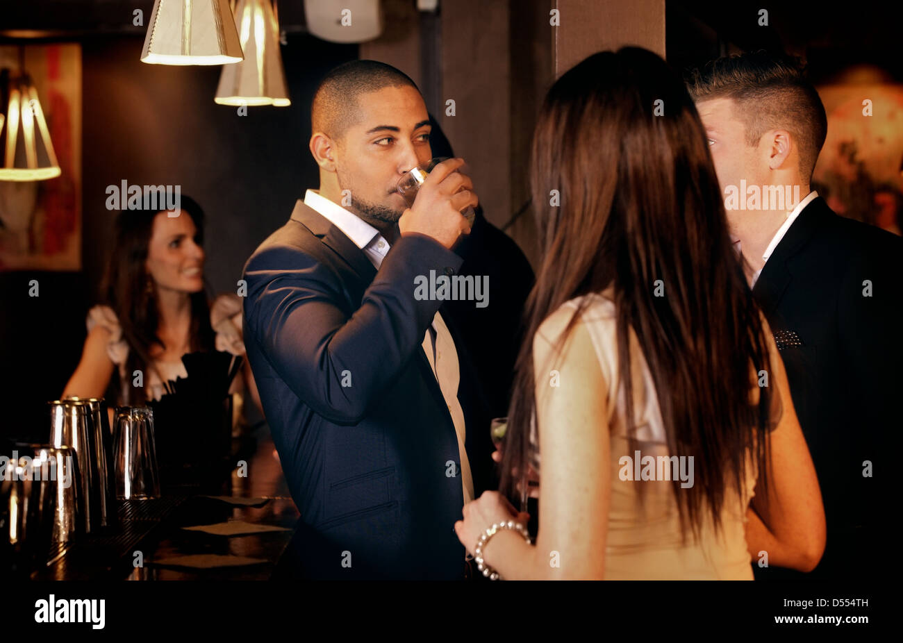 Group people standing at bar hi-res stock photography and images - Alamy