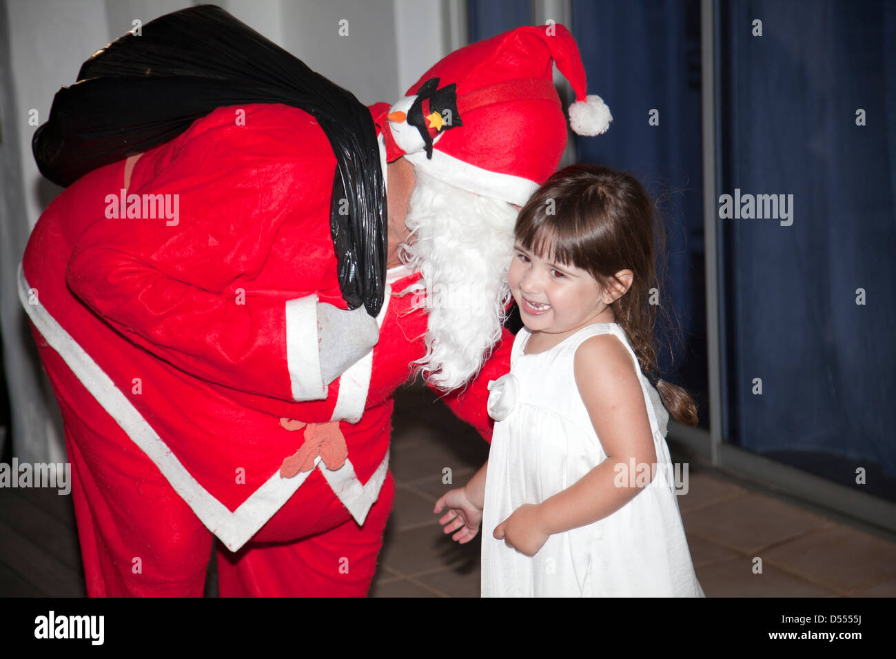 Father Christmas arriving to hand out presents Stock Photo - Alamy