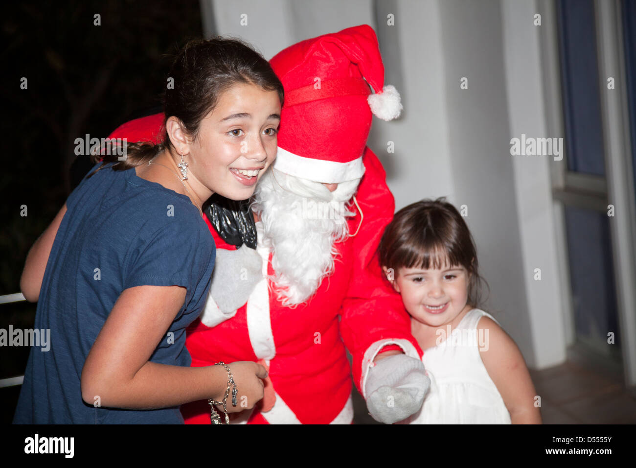 Father Christmas arriving to hand out presents Stock Photo - Alamy