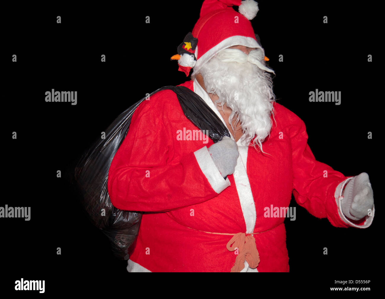 Father Christmas arriving to hand out presents Stock Photo - Alamy
