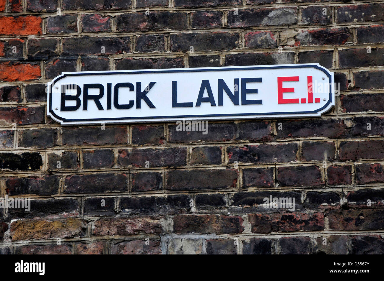 A road sign in Brick Lane, the famous curry district in London, UK ...