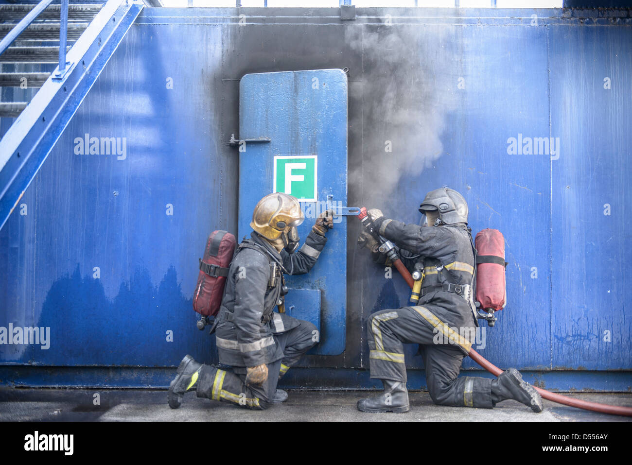 Firefighter fighting training hi-res stock photography and images - Alamy