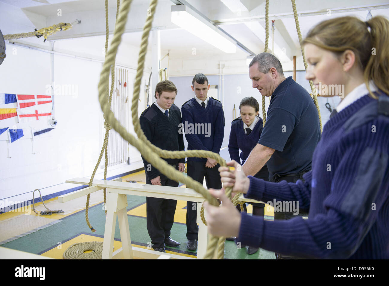 Teacher demonstrating nautical knots Stock Photo - Alamy