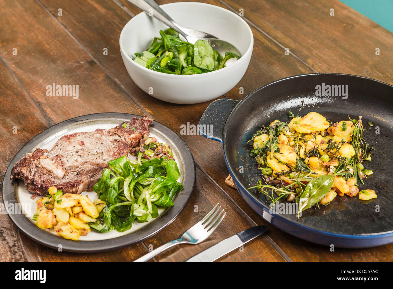 Meat, vegetables and potatoes on table Stock Photo - Alamy