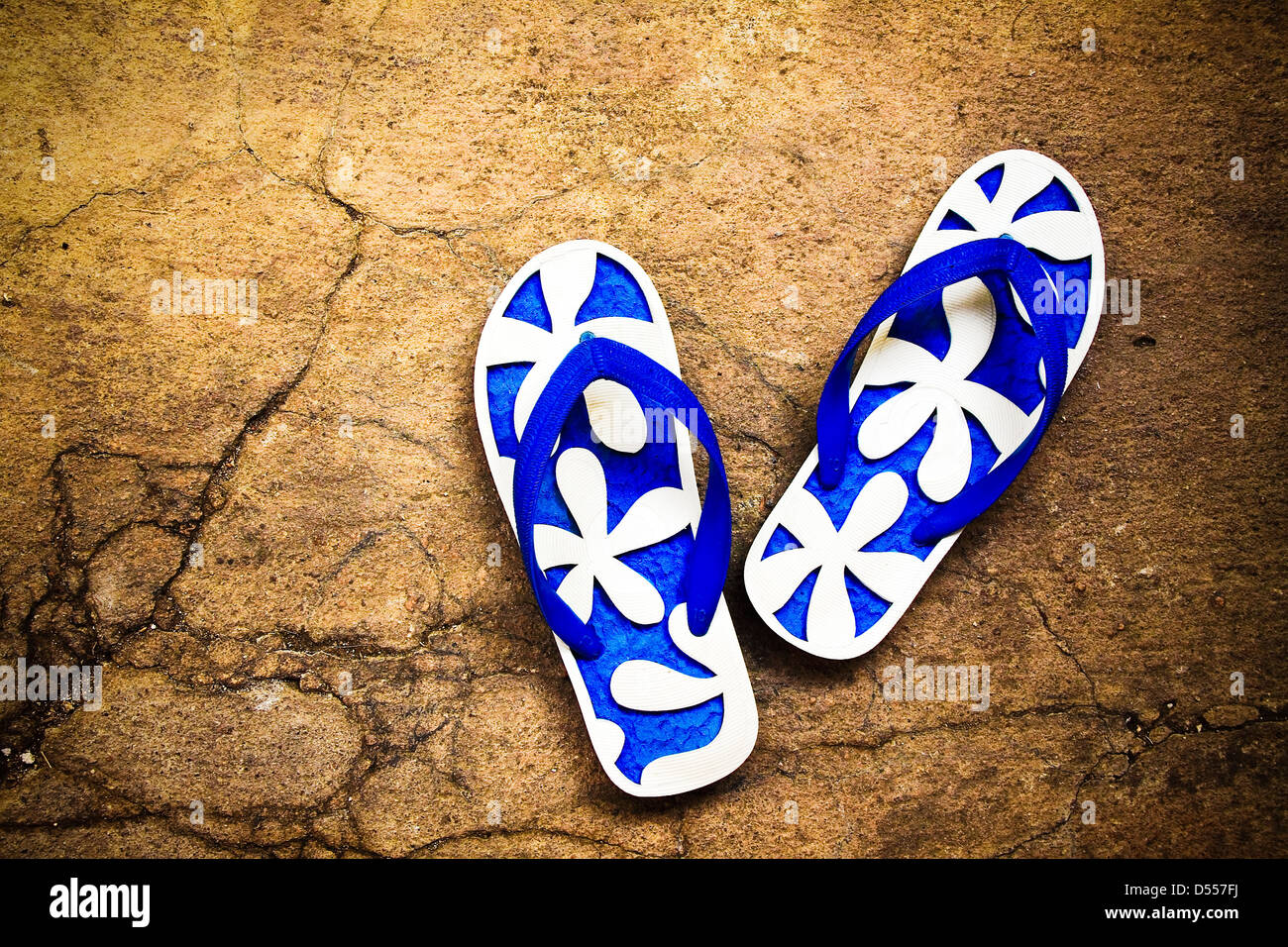 a pair of slipper on cement background Stock Photo - Alamy