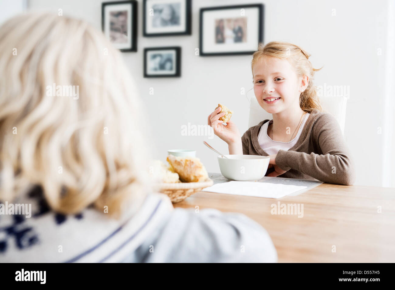Girls eating lunch at table together Stock Photo - Alamy