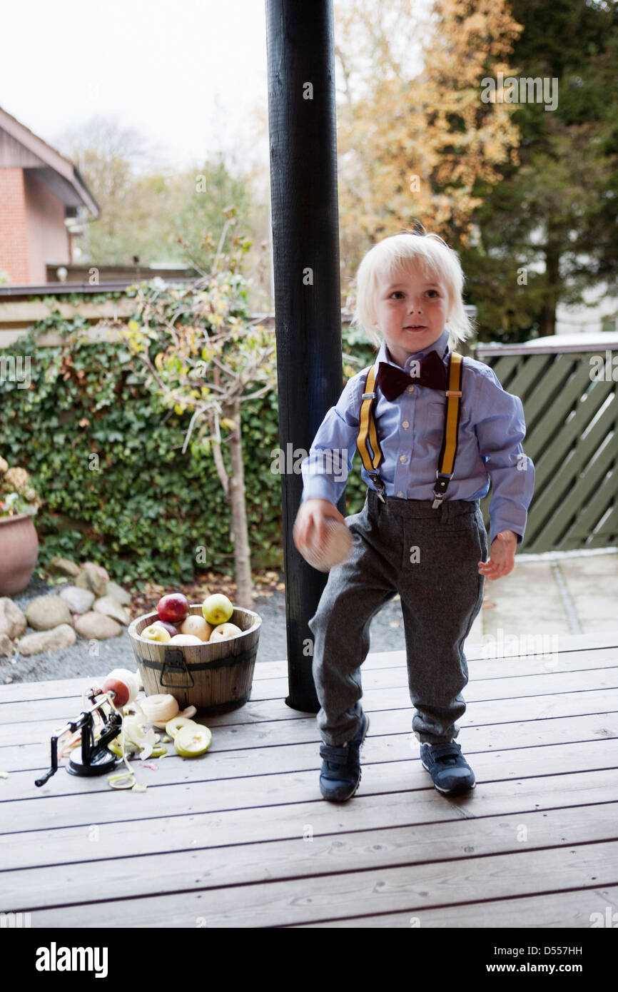 Boy wearing suspenders and bow tie Stock Photo - Alamy