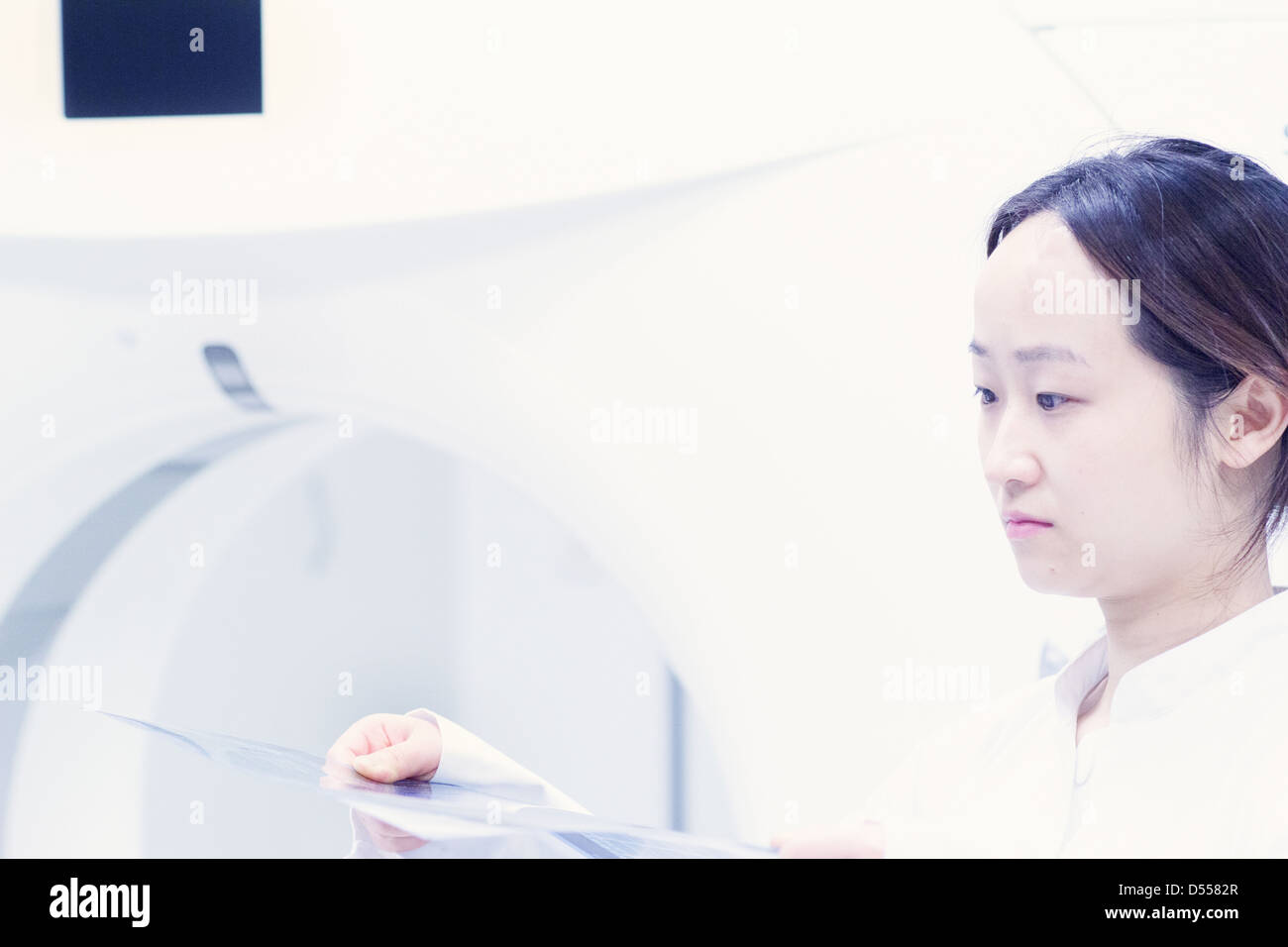 Doctor operating CT scanner in hospital Stock Photo - Alamy