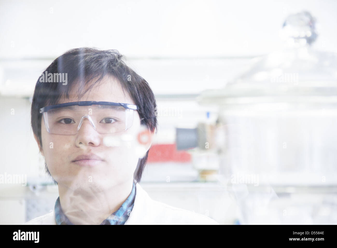 Black male scientist looking chemical hi-res stock photography and ...