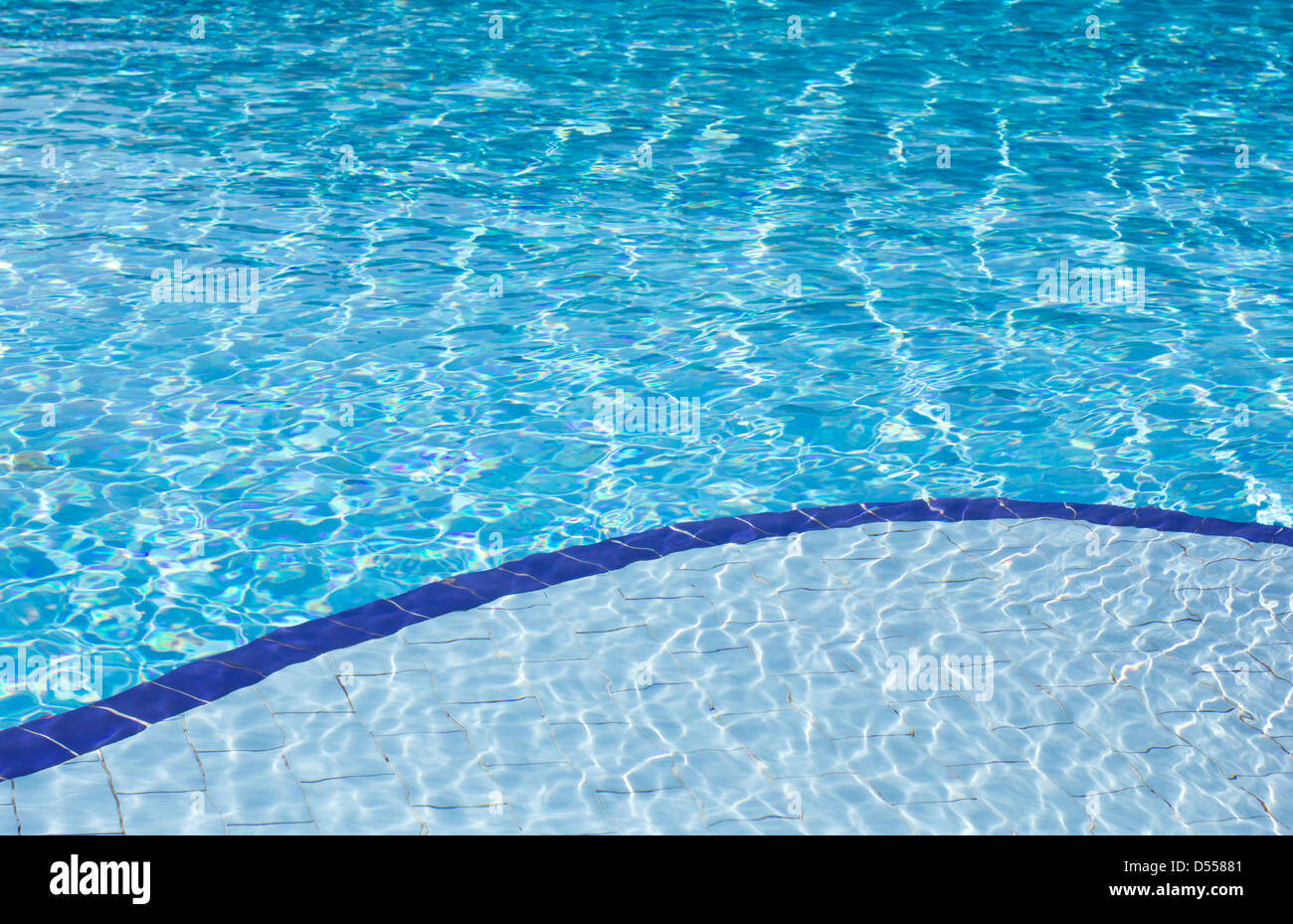 Clear blue water in outdoor swimming pool Stock Photo - Alamy