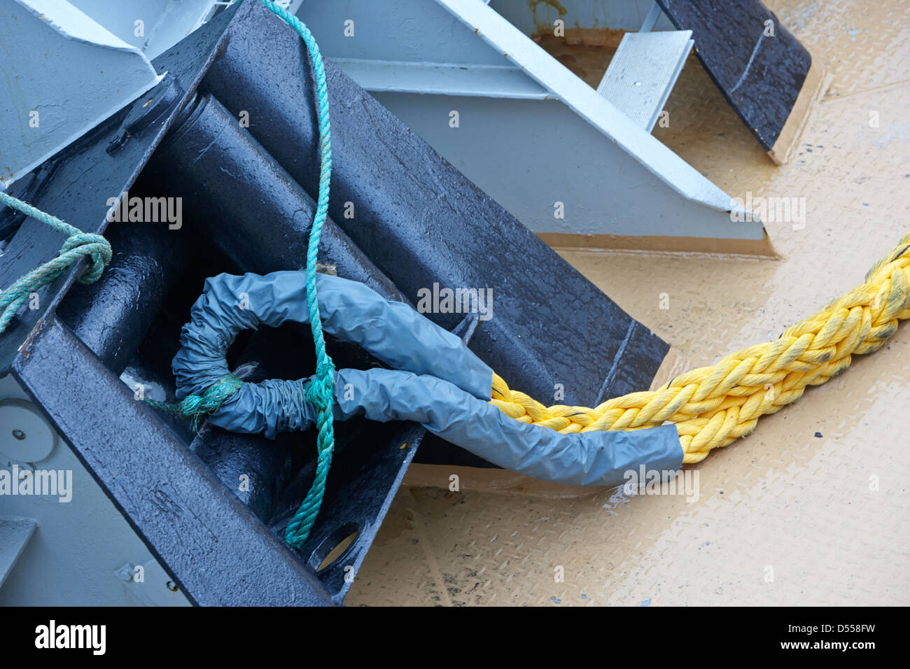 ships tying up ropes on boardship at sea ready with guide line to tie ...