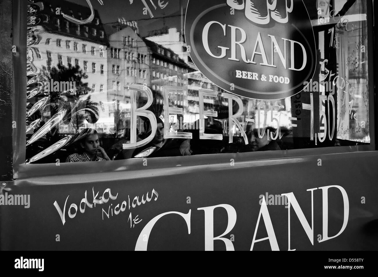 a pub on a street fith reflection of houses Stock Photo - Alamy