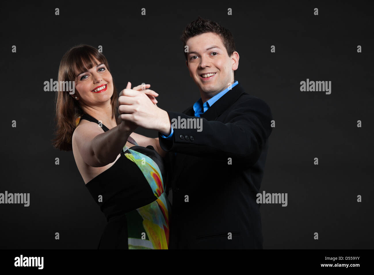 Romantic happy young couple dancing together. Stylish dressed Stock ...